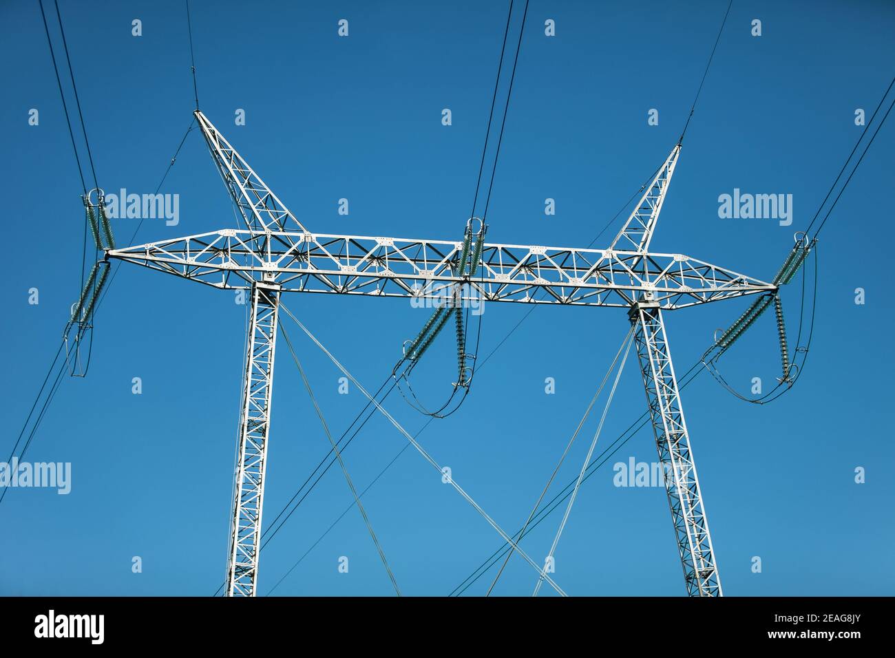 Low angle shot of overhead high-voltage power lines Stock Photo - Alamy