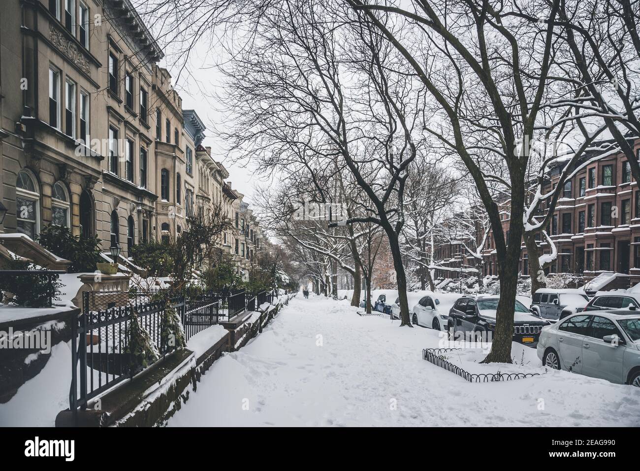 Winter scene with snow covered cars parked along streets in Brooklyn ...