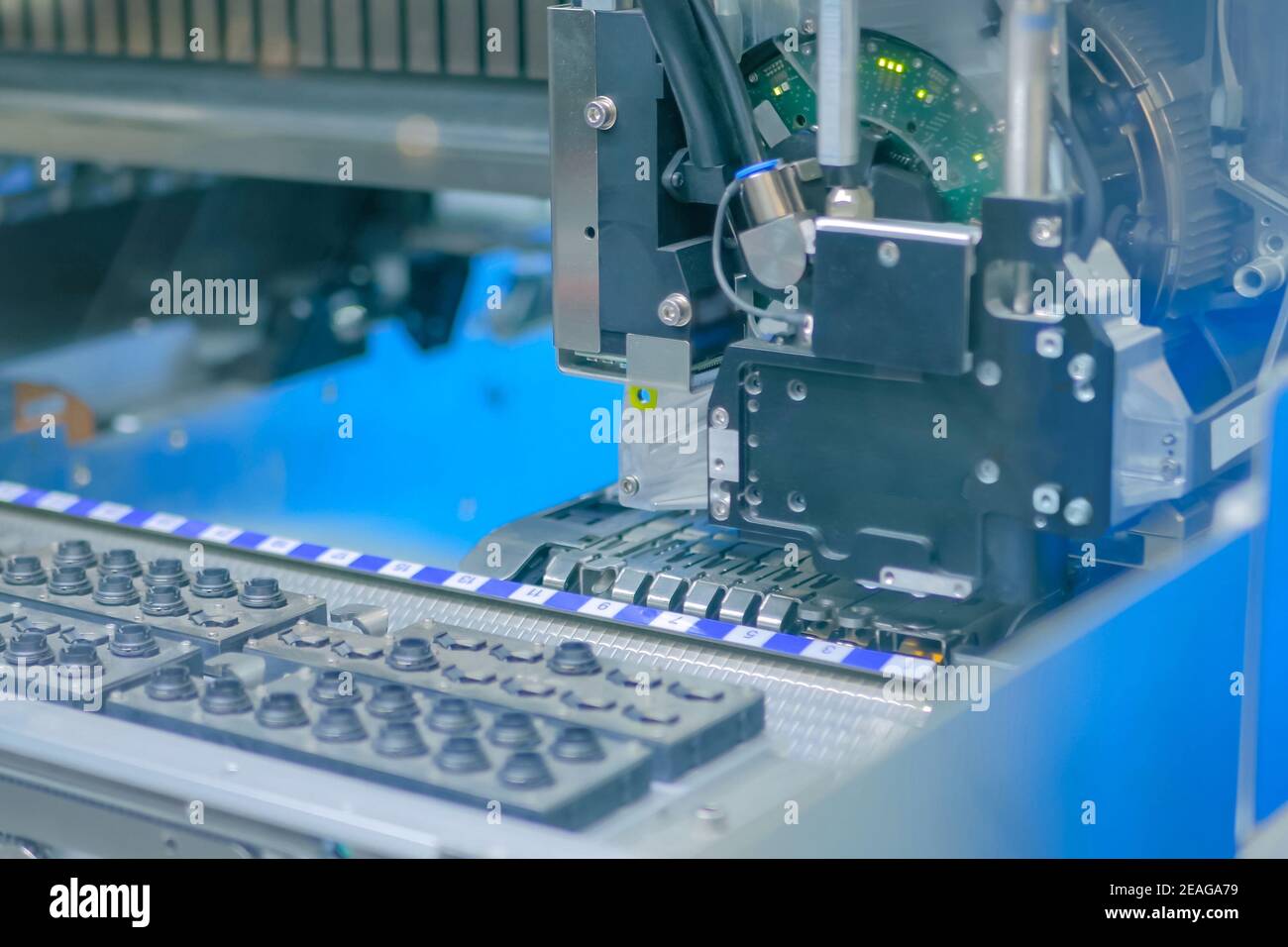 Automatic SMD pick and place machine assembling computer printed circuit board Stock Photo - Alamy