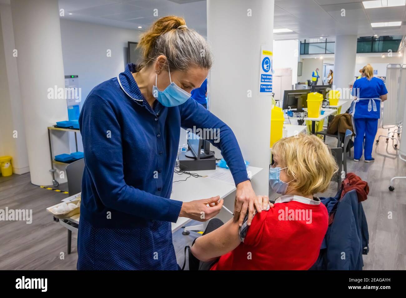 Doctor receives vaccine england hi-res stock photography and images - Alamy