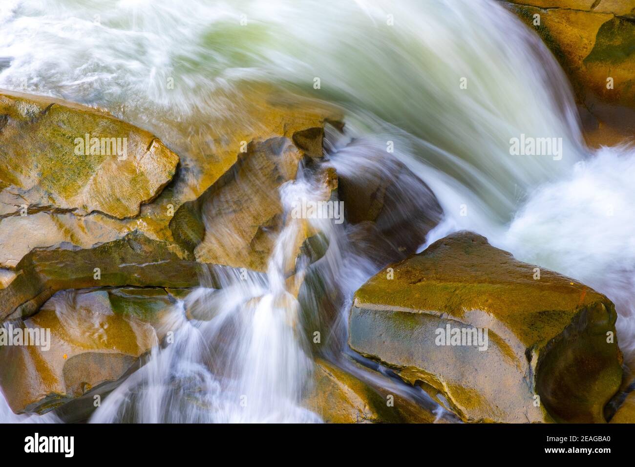 Aerial view of river waterfall with clear turquoise water falling down ...