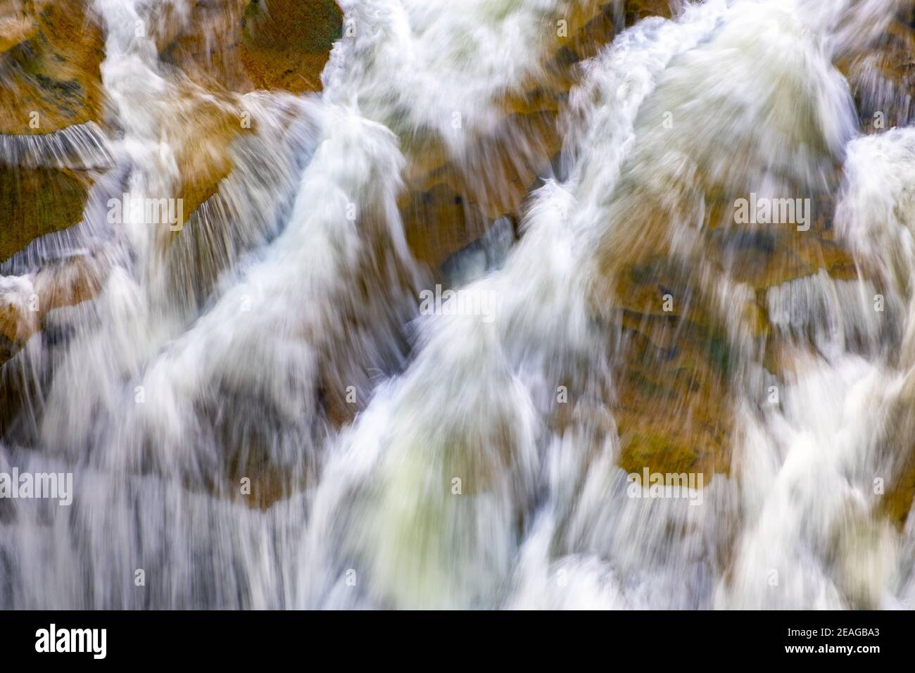 Mountain river with small waterfall with clear turquoise water falling ...