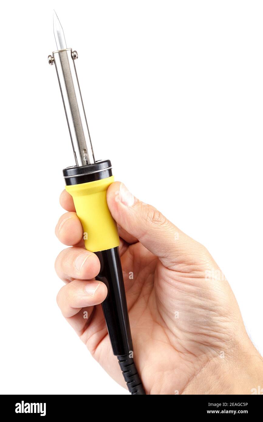 A soldering iron in a hand isolated on a white background Stock Photo ...
