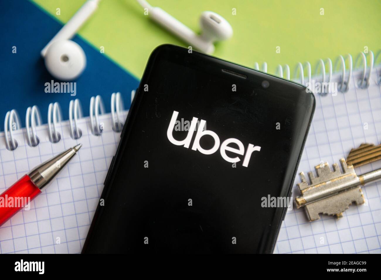 In this photo illustration, a Uber logo seen displayed on a smartphone ...