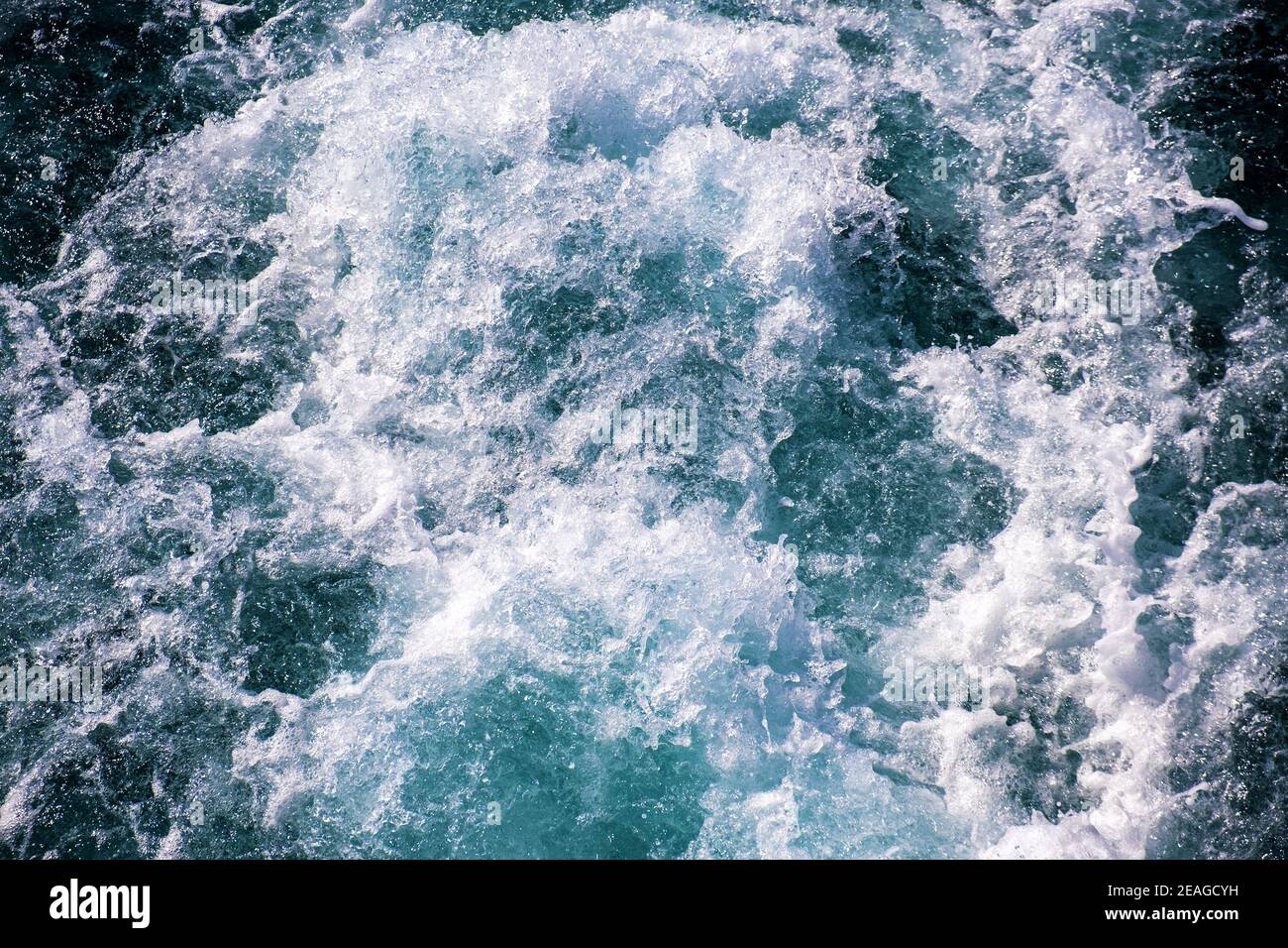Top down aerial view of sea water surface. White foam waves texture as ...