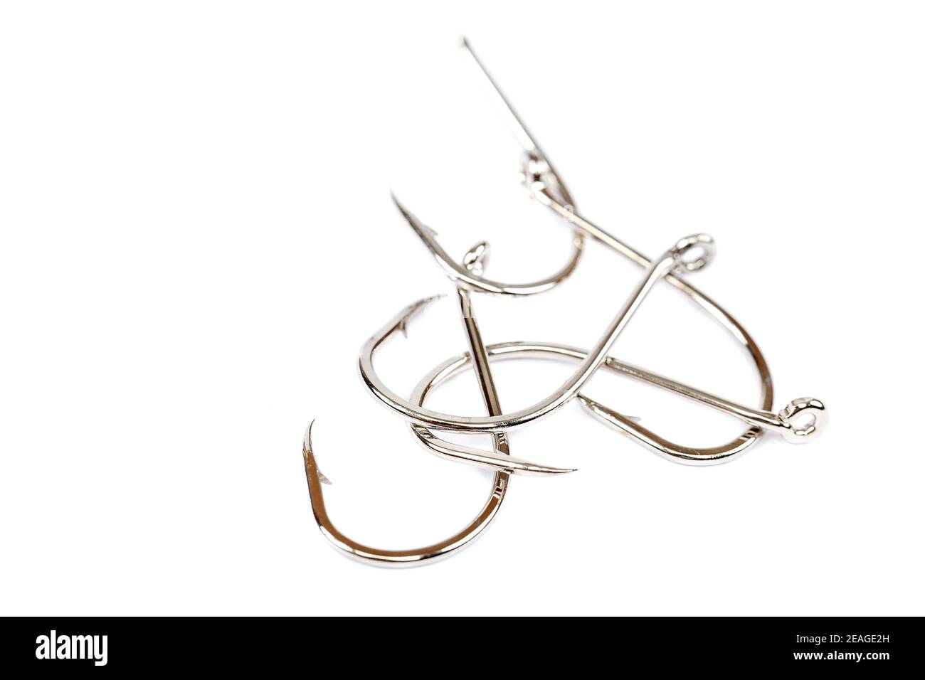 Fishing hooks isolated on white background Stock Photo - Alamy