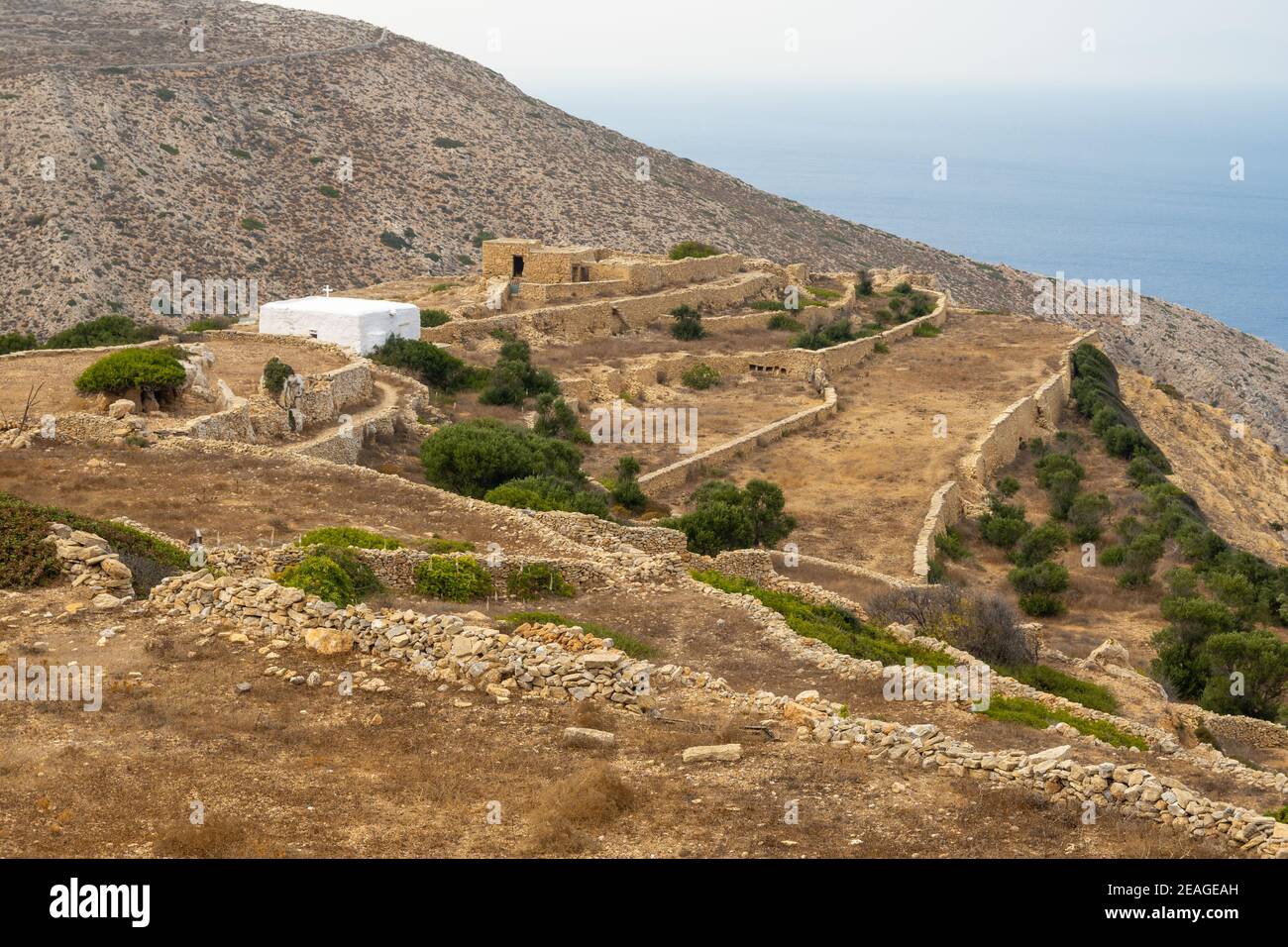 A white chapel on the hillside in Folegandros, beautiful Greek island ...