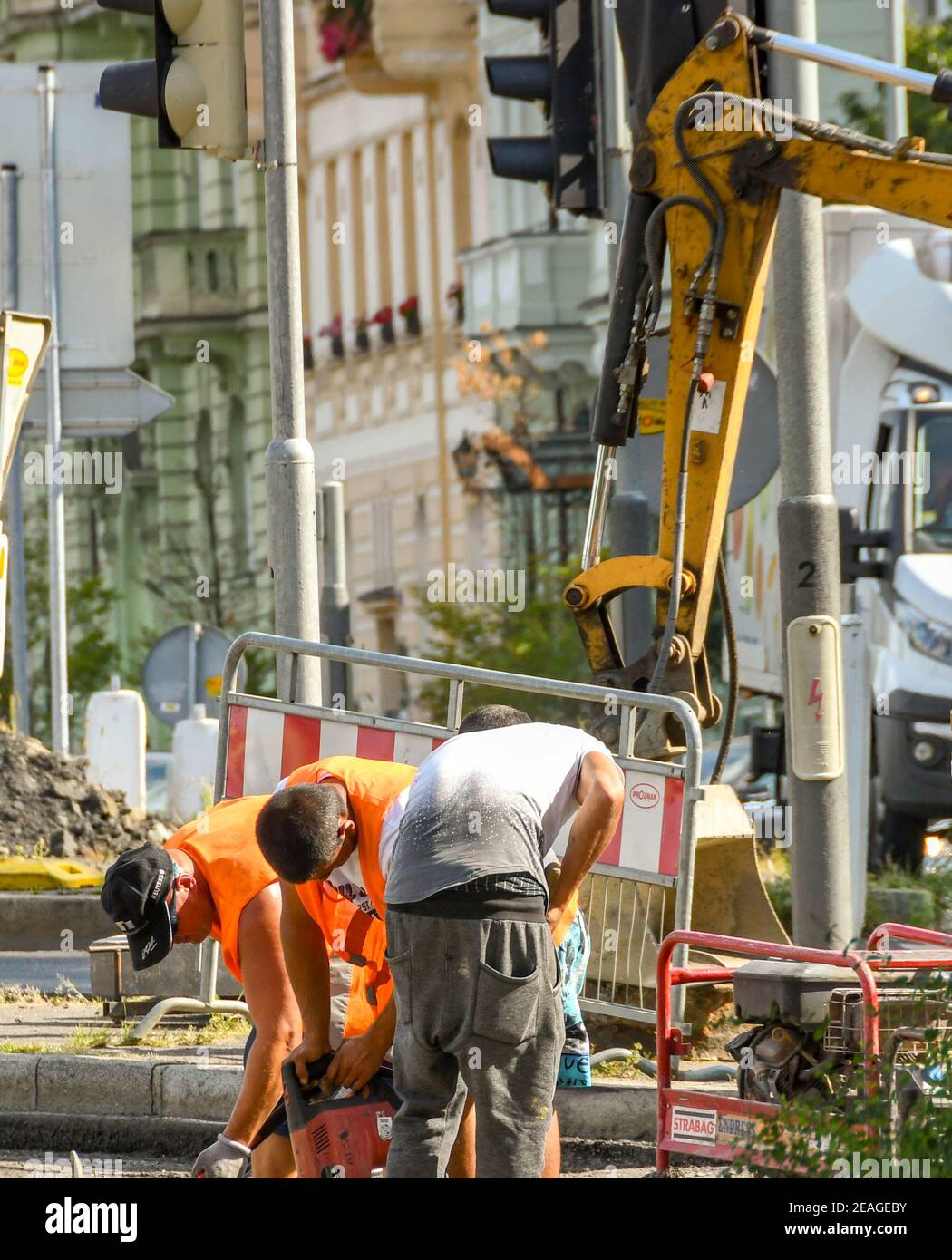PRAGUE, CZECH REPUBLIC - AUGUST 2018: Construction workers digging up a ...