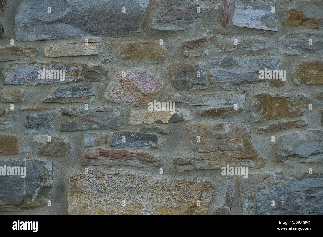 Stone wall of natural stones in different sizes; Rustic stone veneer in ...