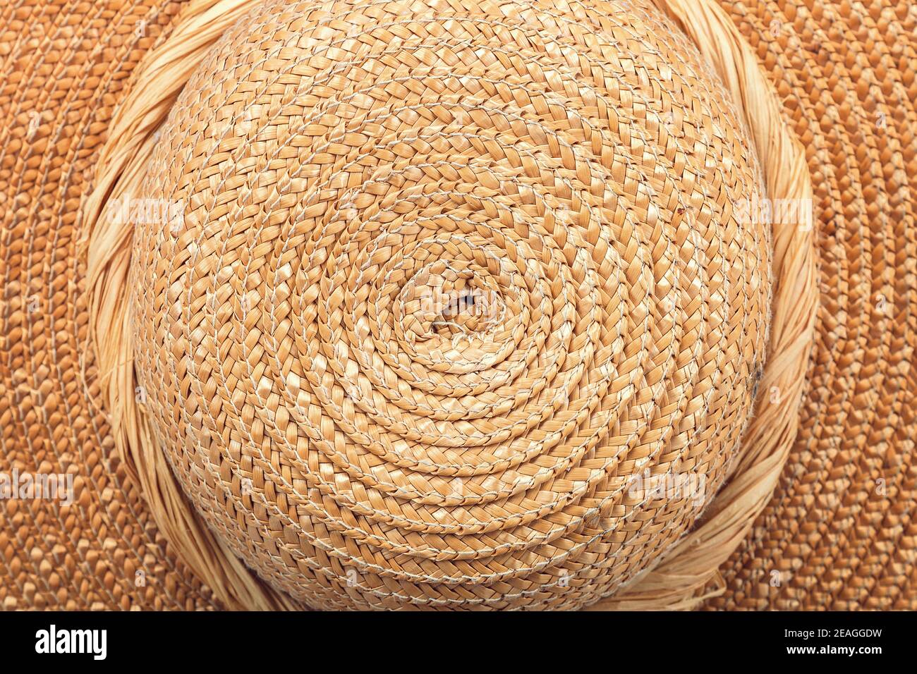 Straw wicker hat as a background Stock Photo - Alamy