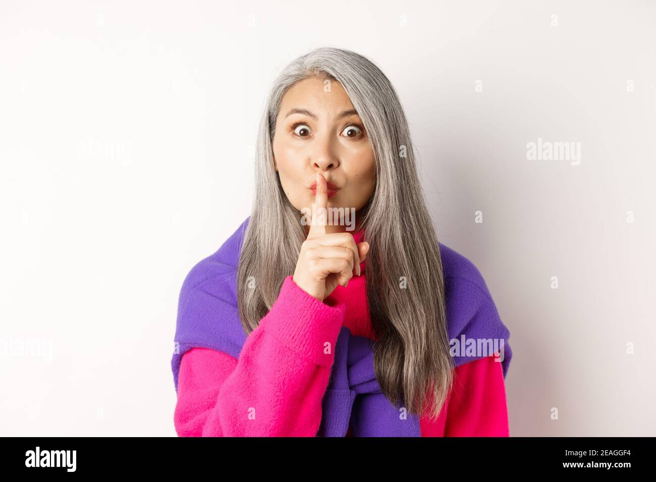 Asian woman shushing hi-res stock photography and images - Alamy