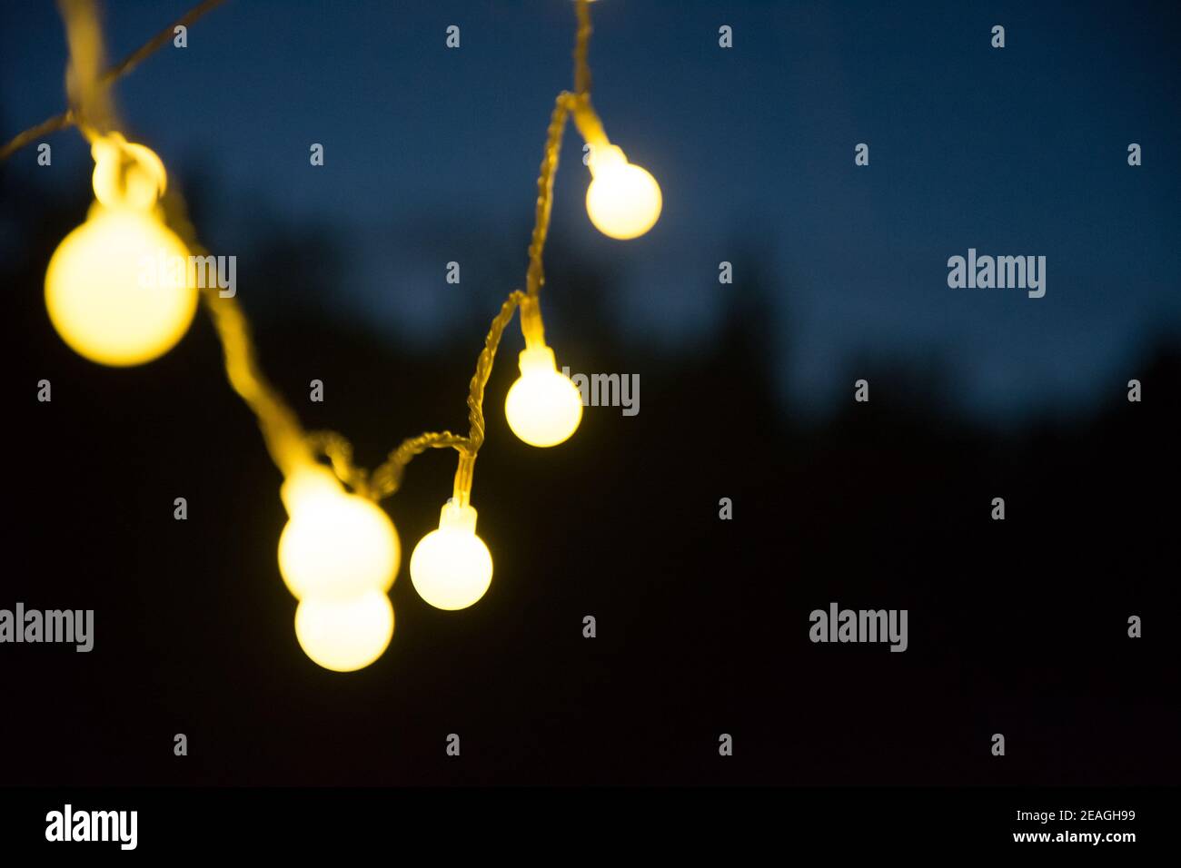 Chain of lights brings light into the dark night - a cozy atmosphere ...