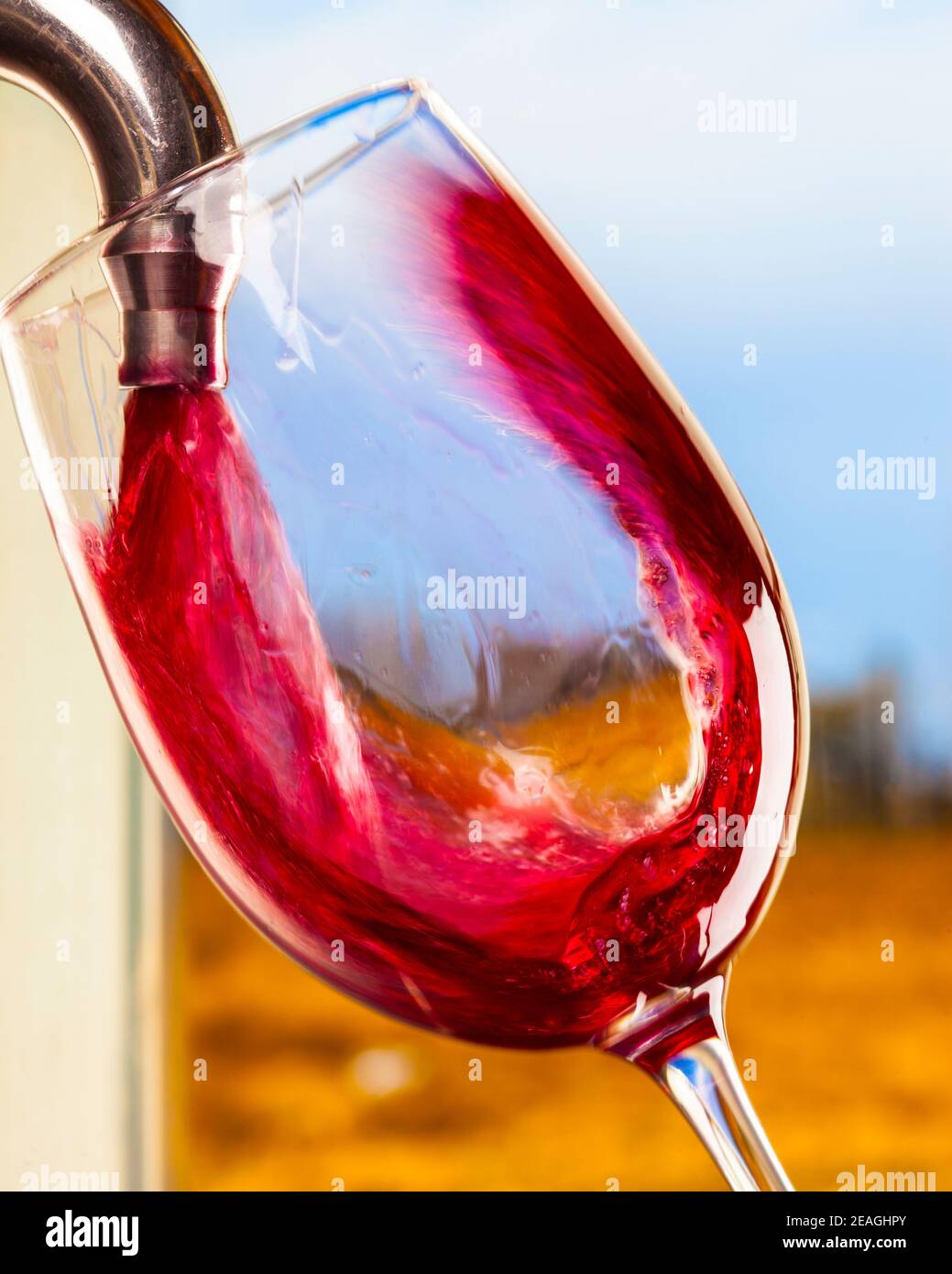 red wine glass barrel faucet Stock Photo - Alamy