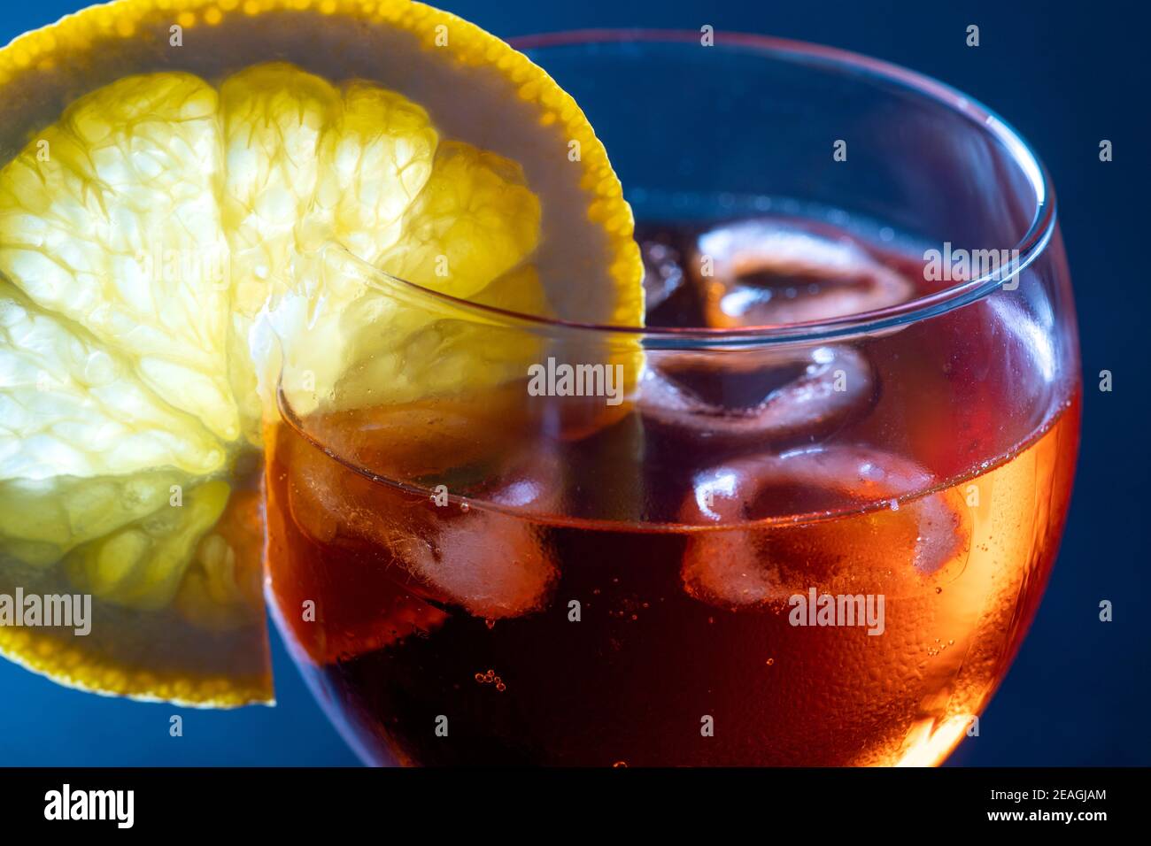italian spritz in a glass on black Stock Photo - Alamy