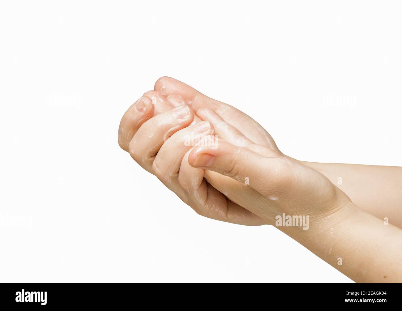 Female hands isolated on white, applying cream, massage. hand in hand ...