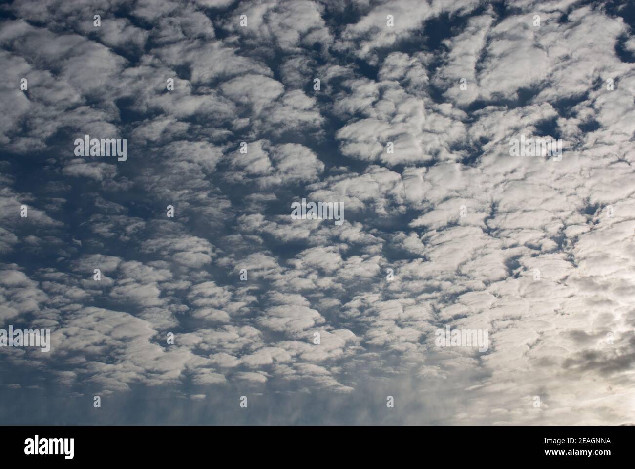 Grey color clouds partly cover the sky in the daytime Stock Photo - Alamy