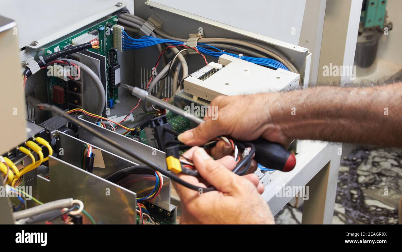 Mechanical and electrical specialist technician of embroidery machines ...