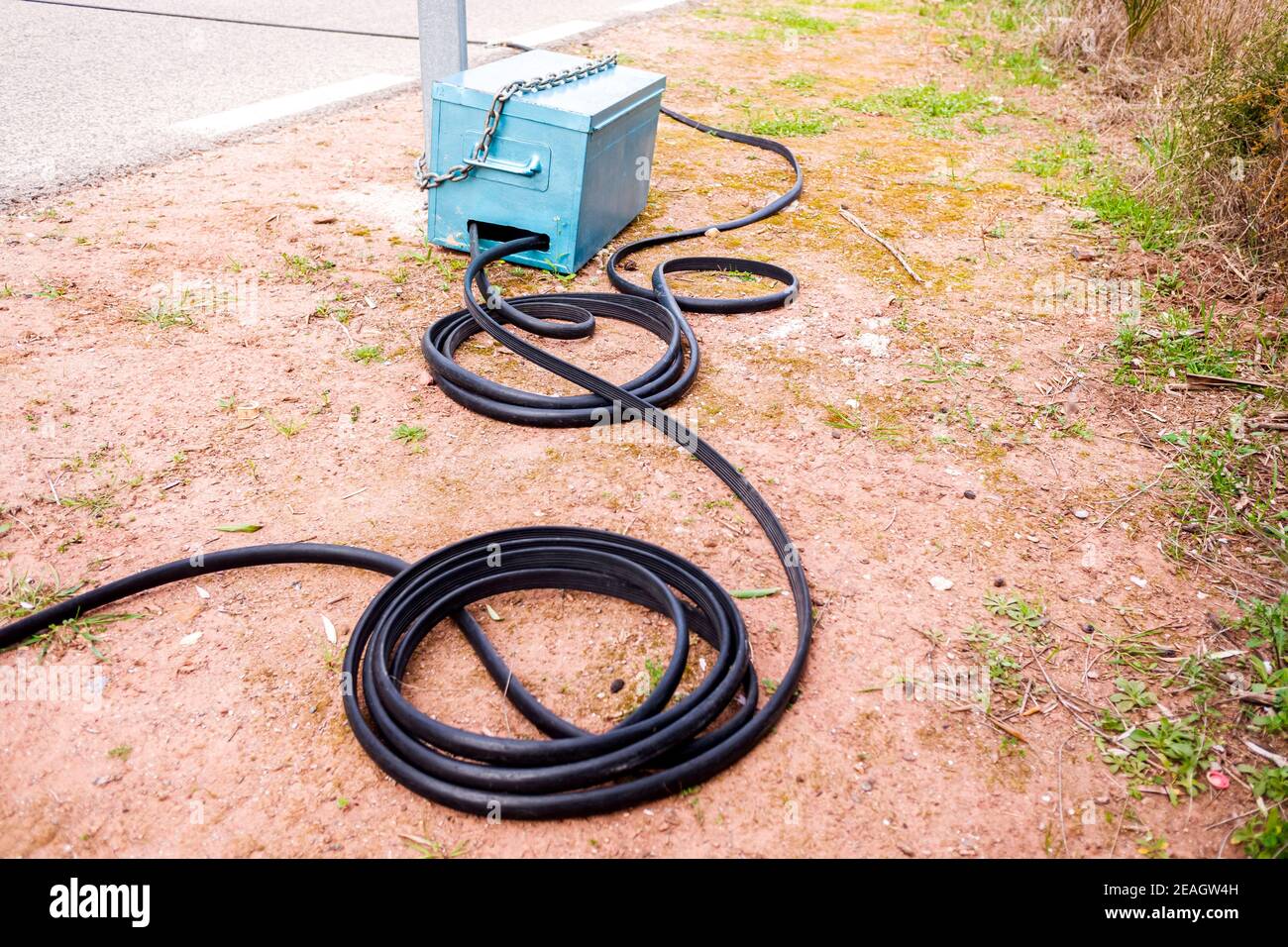 Black pneumatic tube along the road to measure speed and number of ...