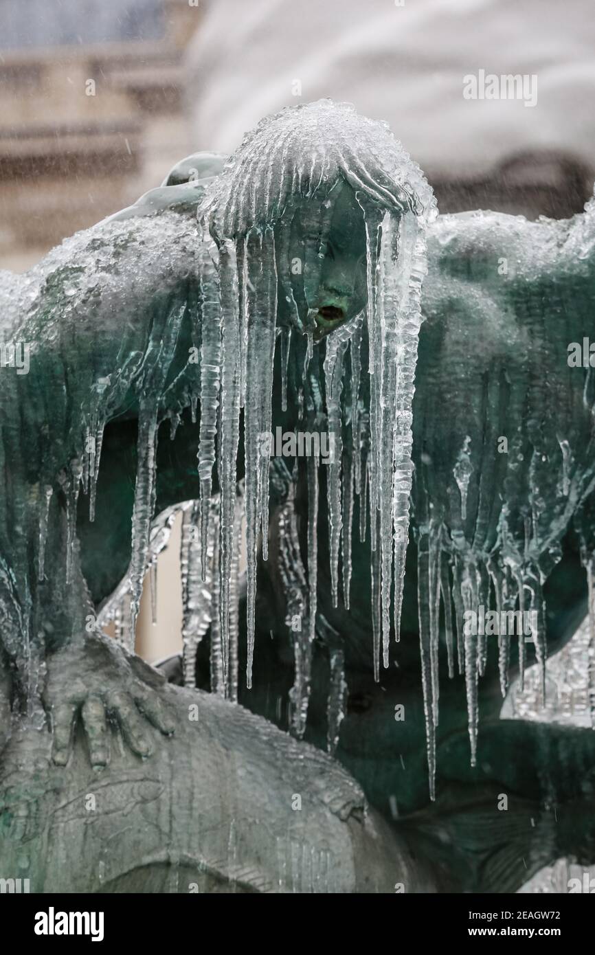 London, UK. 09 Feb 2021. UK Weather: An ice covered frozen fountain in ...