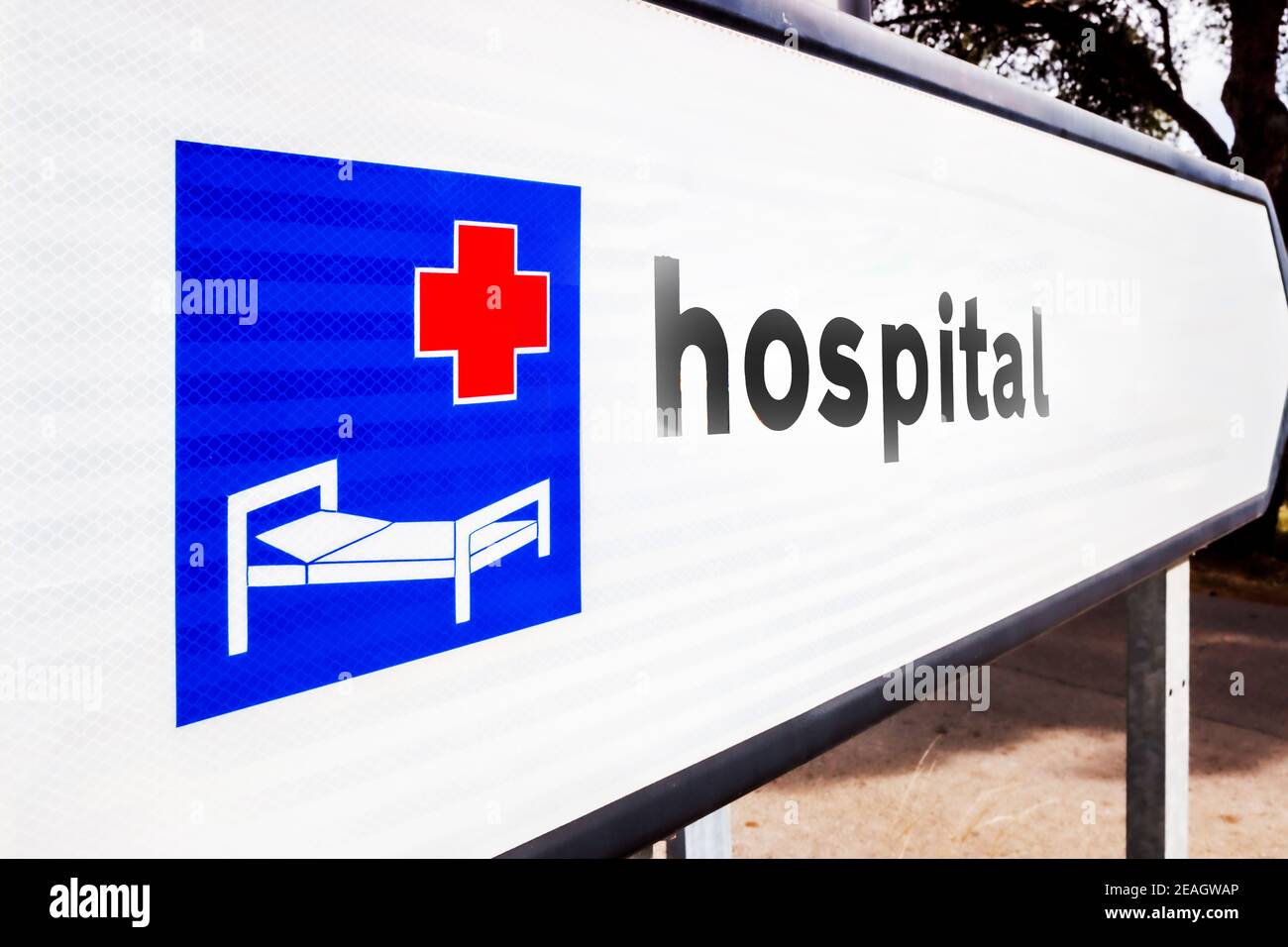 Road sign indicating the direction of a hospital Stock Photo - Alamy