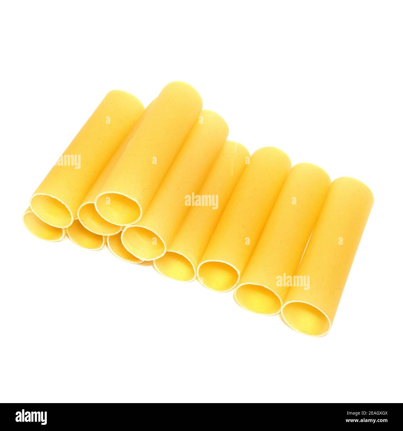 Yellow cannelloni pasta isolated on white background Stock Photo - Alamy