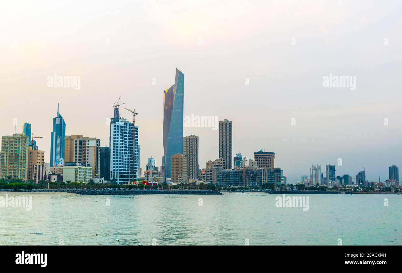 Skyline of Kuwait during sunset Stock Photo - Alamy