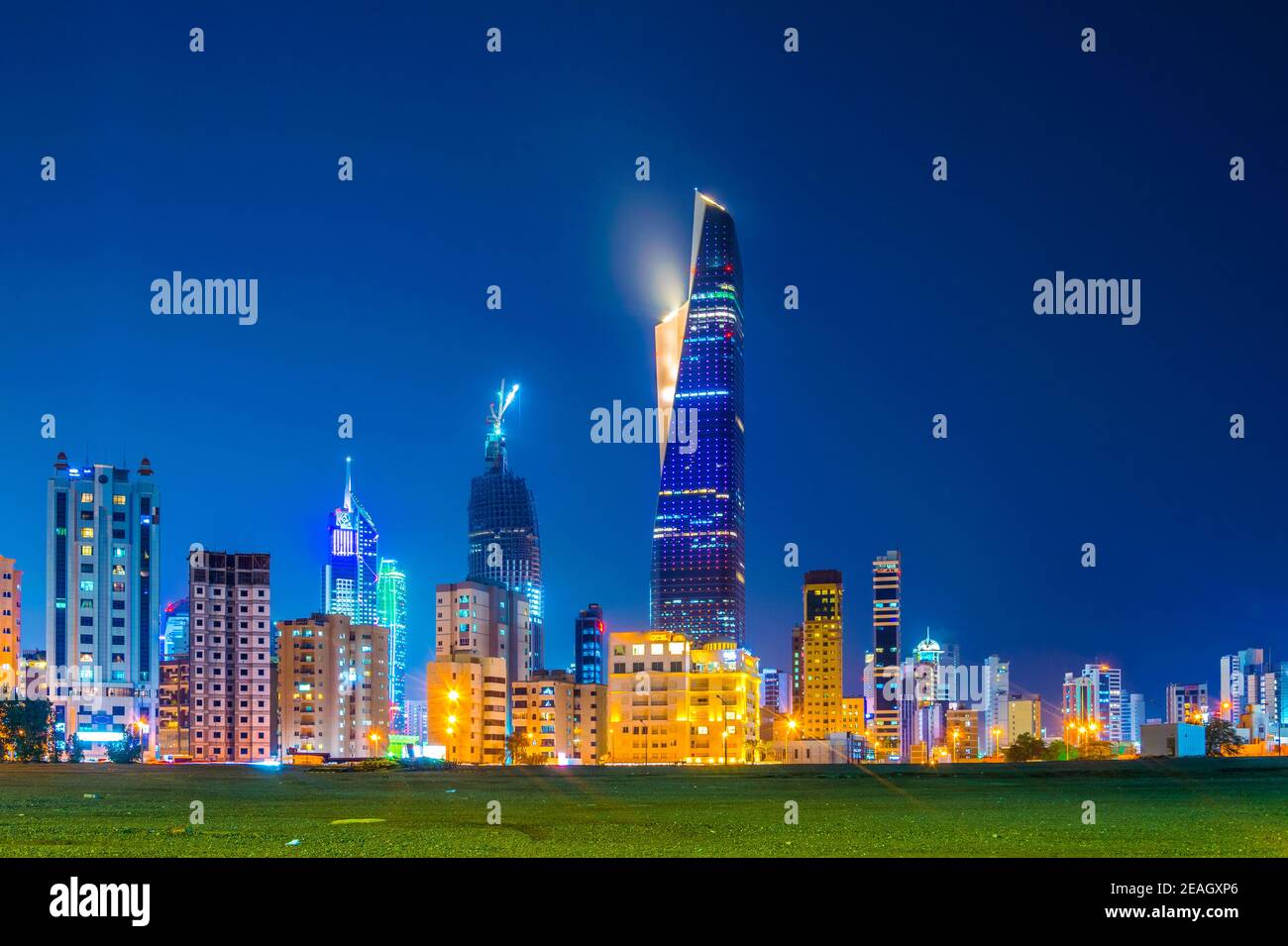 Skyline of Kuwait during night Stock Photo - Alamy