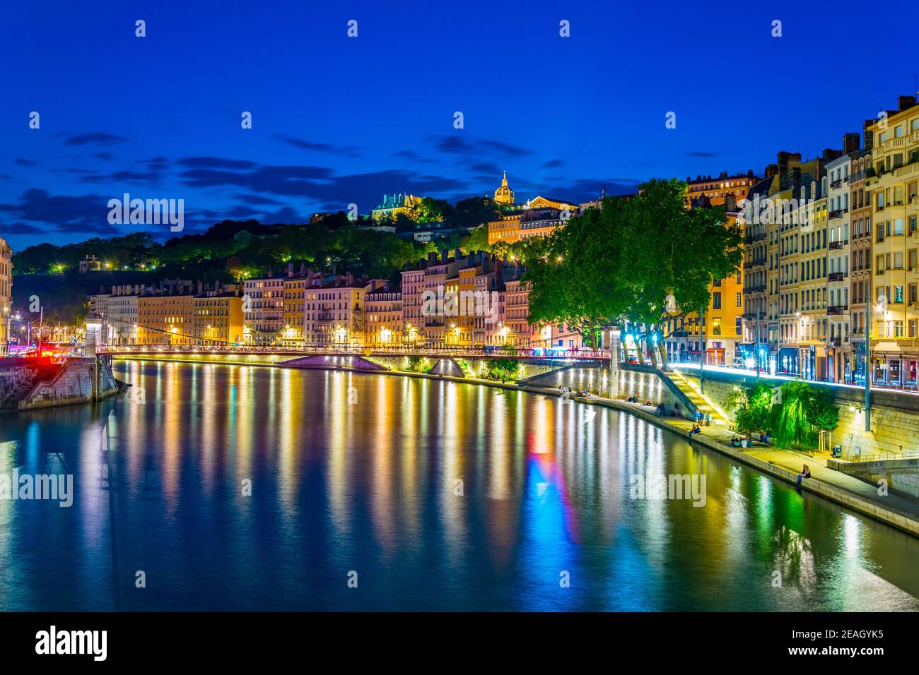 Night view of illuminated riverside of Saone river in Lyon, France ...