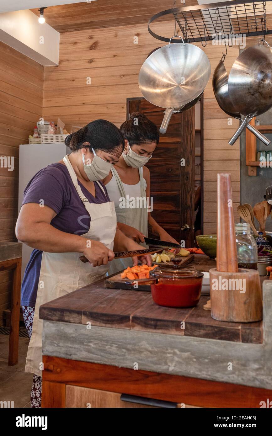 Face Mask Two Asian Female Cooks on Duty Chopping Vegetables Bright ...