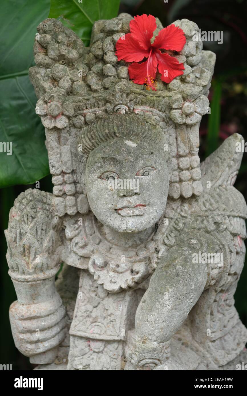 Indonesia Bali - Ubud Handmade Balinese stone statue with red Hibiscus ...