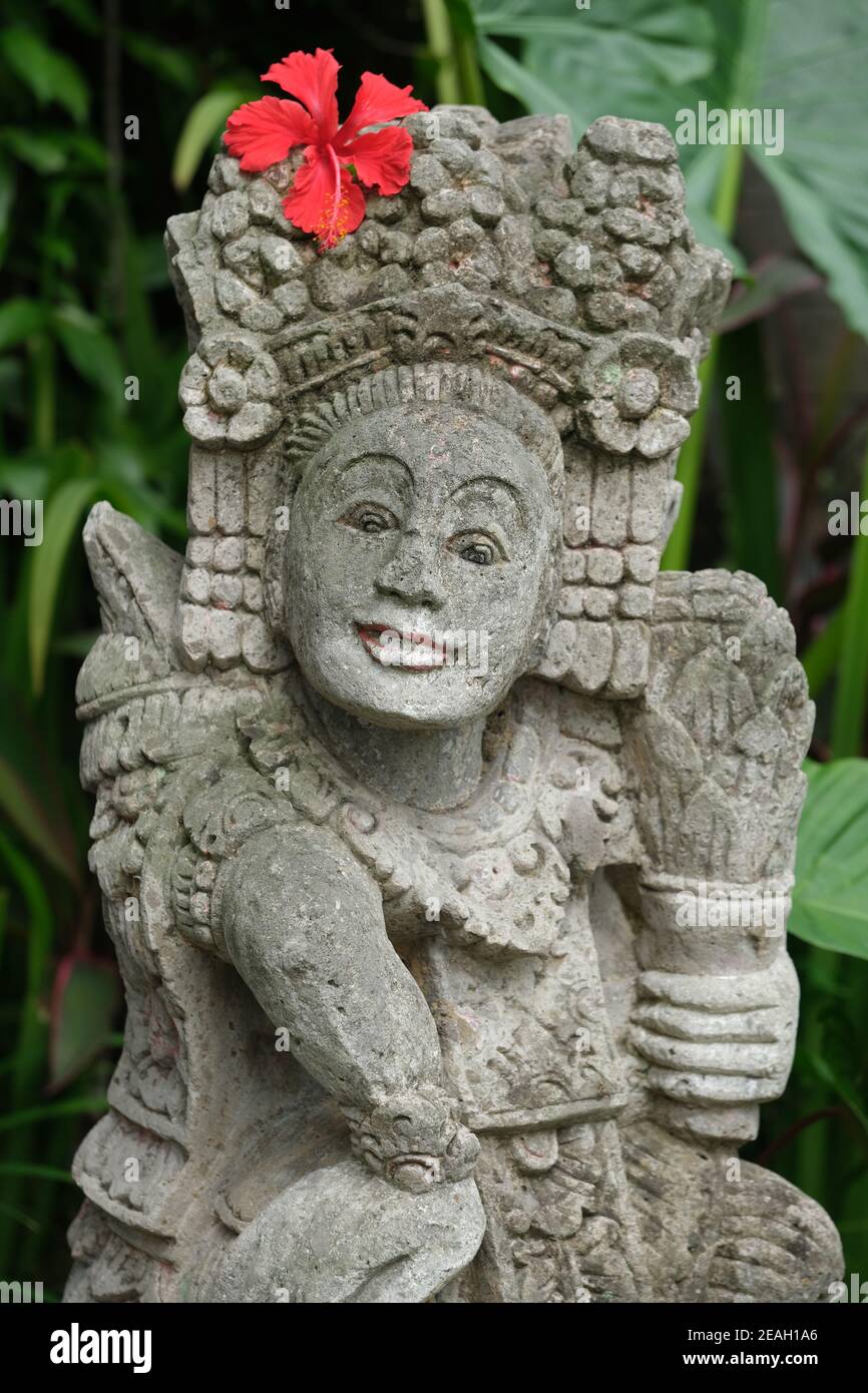 Indonesia Bali - Ubud Handmade Balinese stone statue with red Hibiscus ...