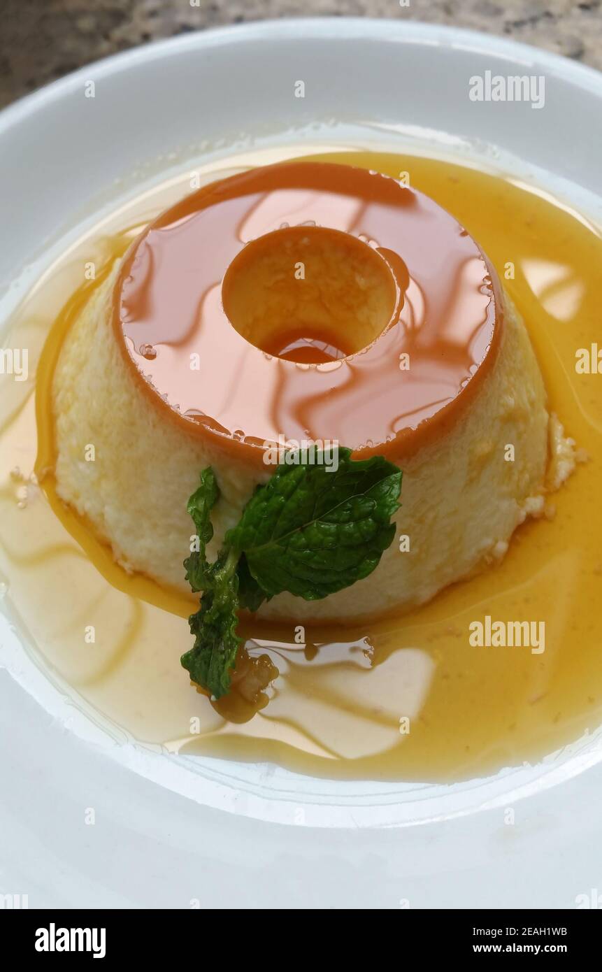 Homemade caramel cream pudding with mint Stock Photo - Alamy