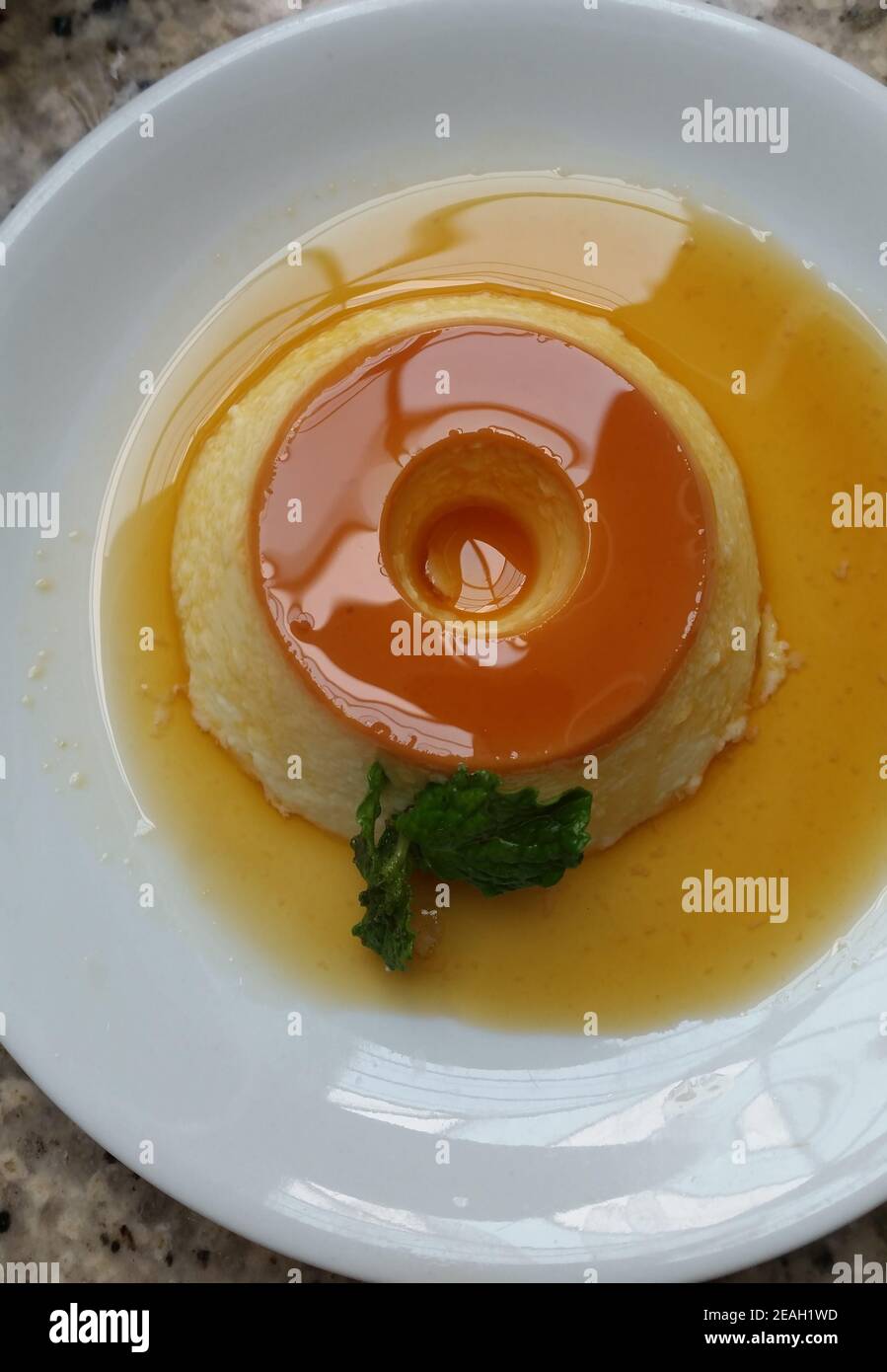 Homemade caramel cream pudding with mint Stock Photo - Alamy