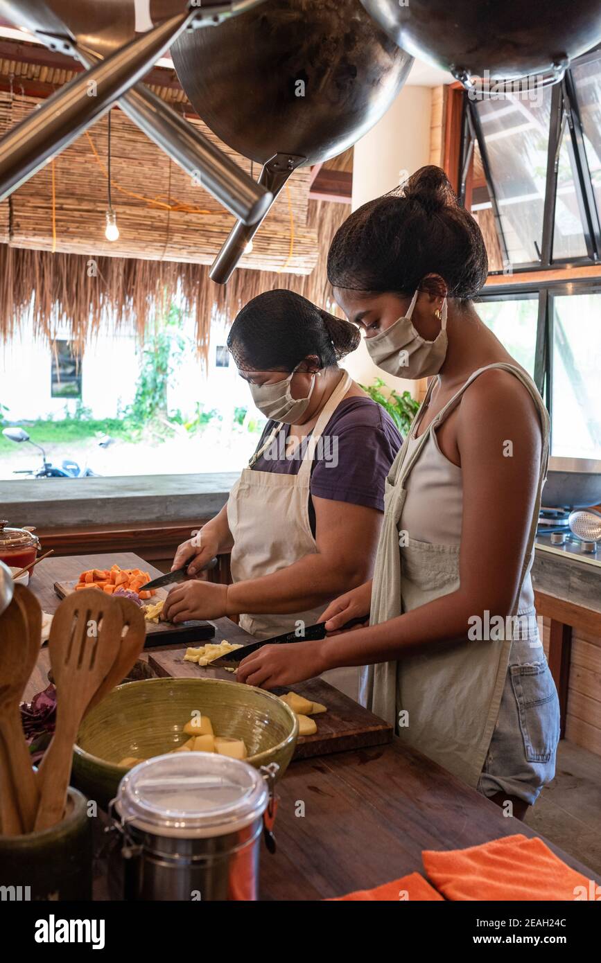 Face Mask Two Asian Female Cooks on Duty Chopping Vegetables Bright ...