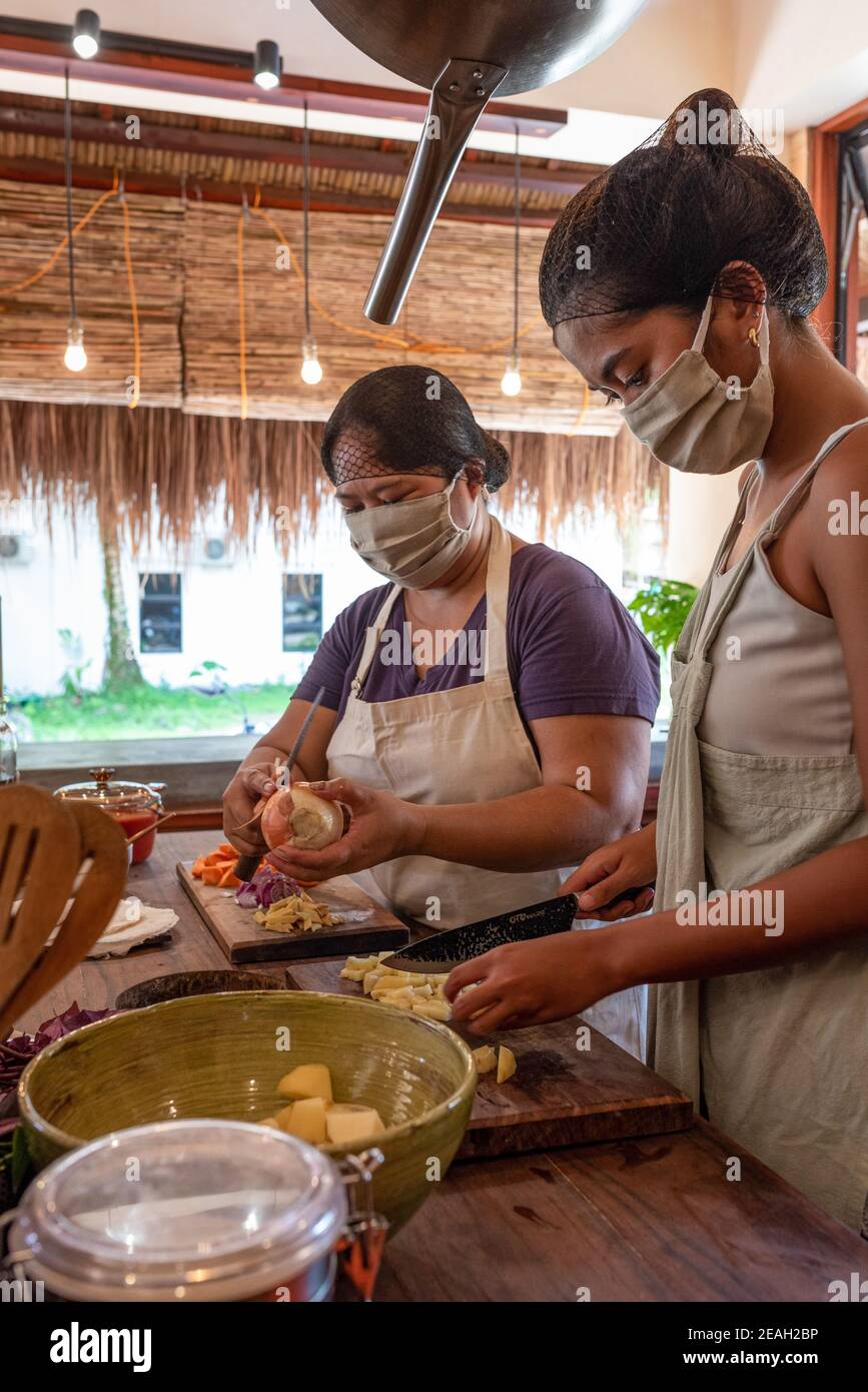Face Mask Two Asian Female Cooks on Duty Chopping Vegetables Bright ...