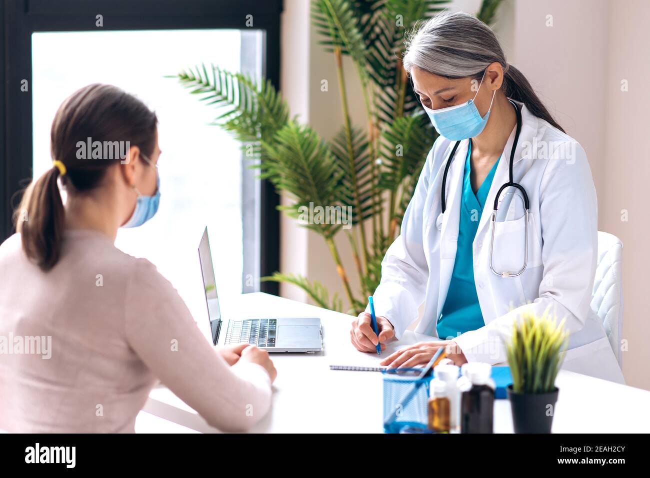 Consultation of a doctor of general medicine. A girl at the doctor's ...