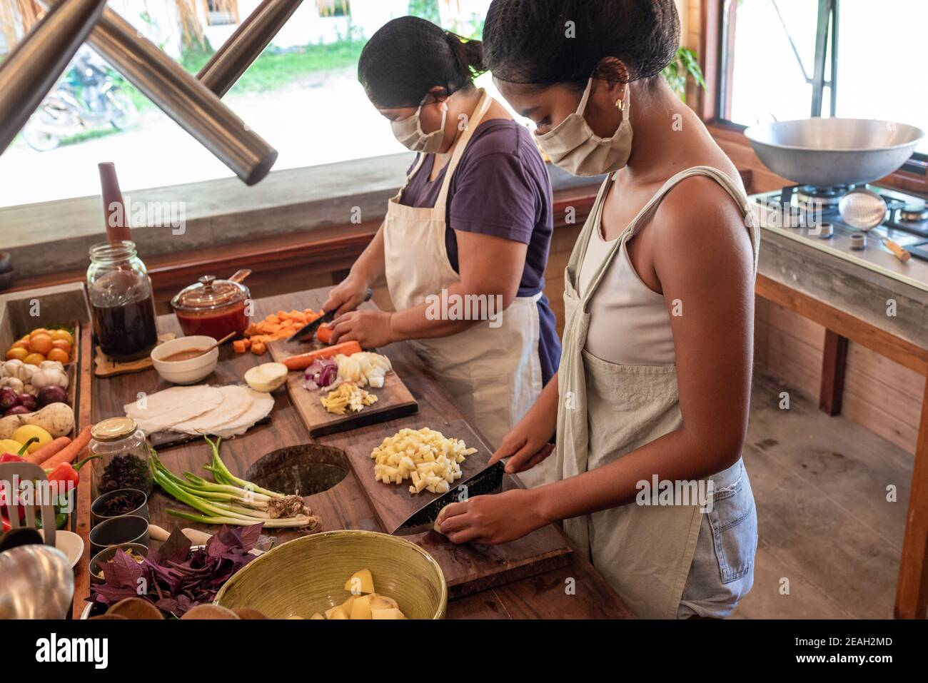 Face Mask Two Asian Female Cooks on Duty Chopping Vegetables Bright ...