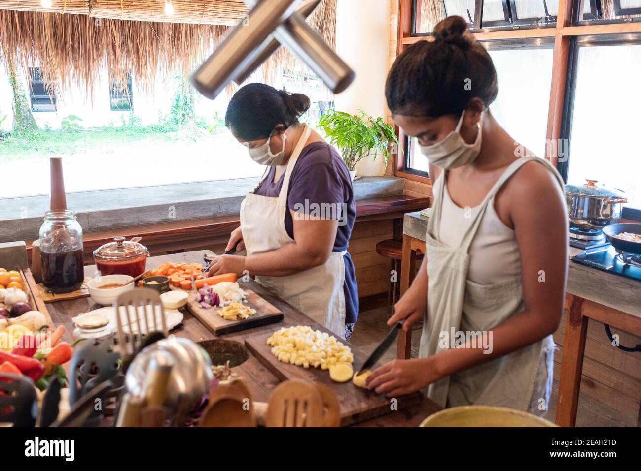 Face Mask Two Asian Female Cooks on Duty Chopping Vegetables Bright ...