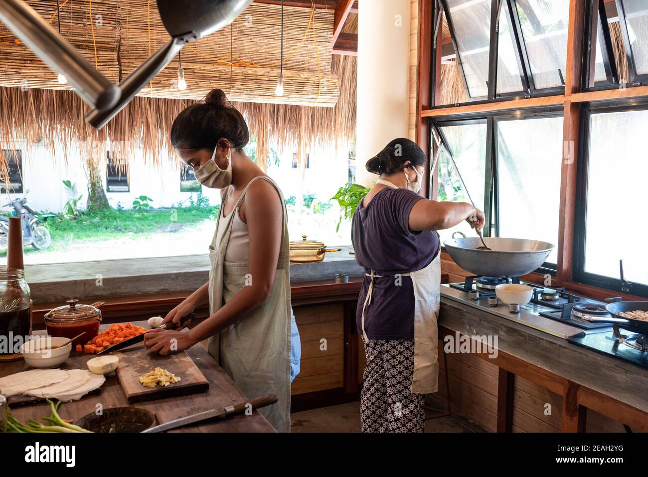 Face Mask Two Asian Female Cooks on Duty Chopping Vegetables Bright ...