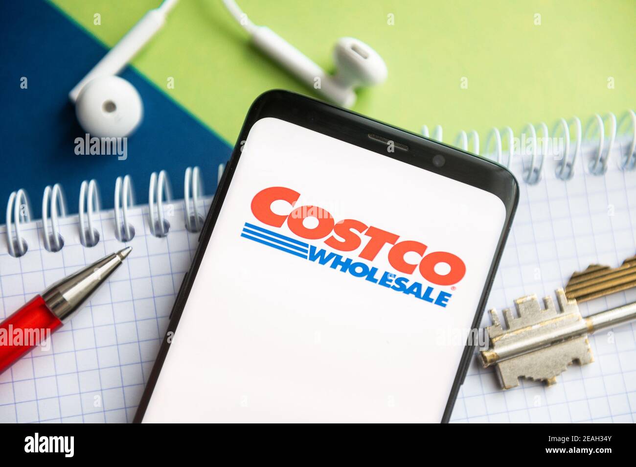 In this photo illustration, a Costco logo seen displayed on a ...