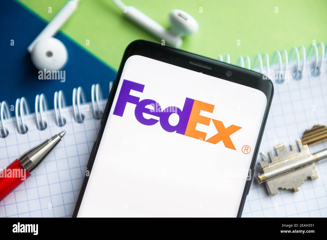 In this photo illustration, a FedEx logo seen displayed on a smartphone ...