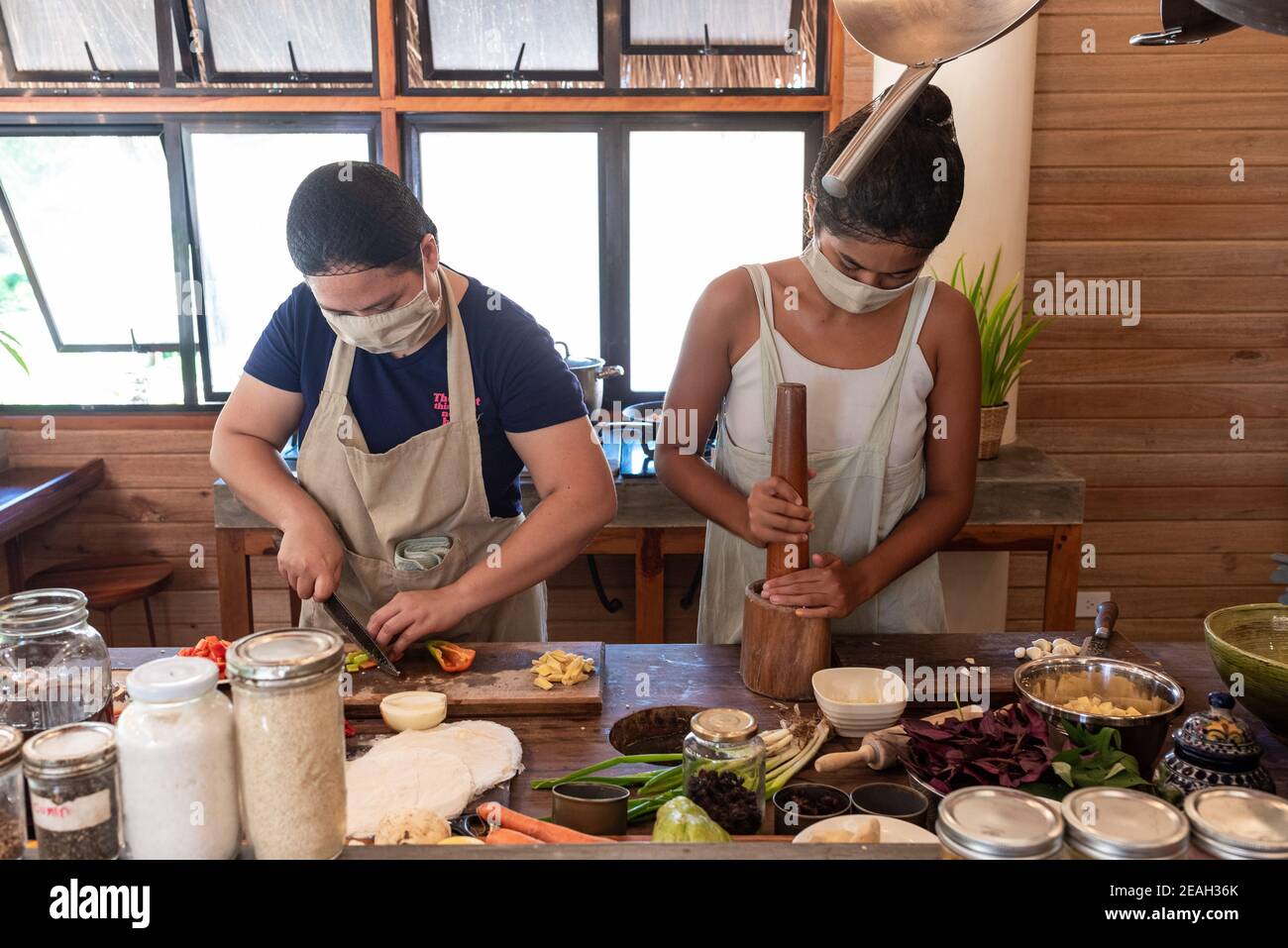 Face Mask Two Asian Female Cooks on Duty Chopping Vegetables Bright ...