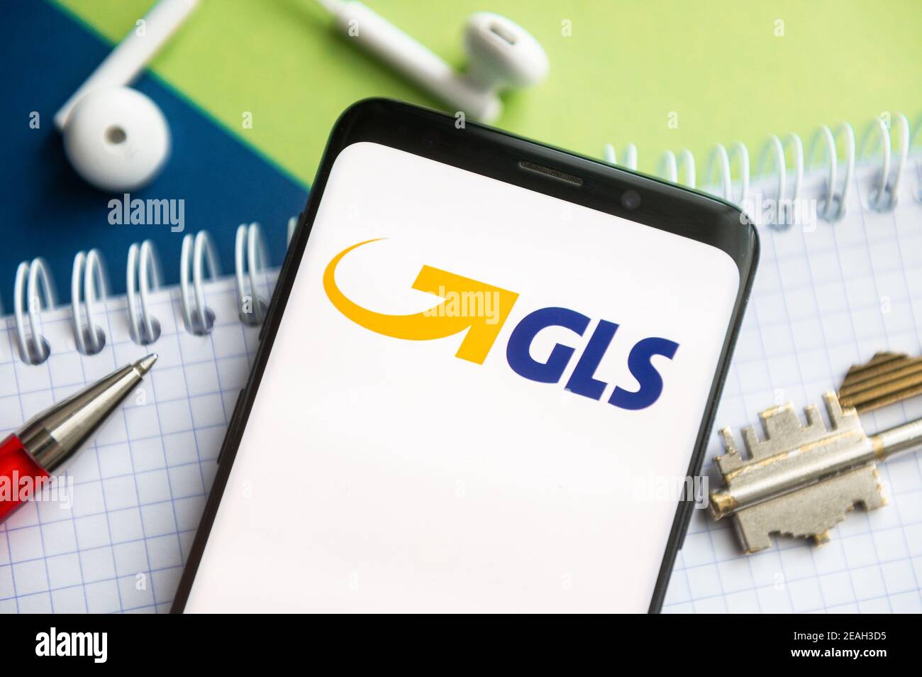 In this photo illustration, a GLS logo seen displayed on a smartphone ...