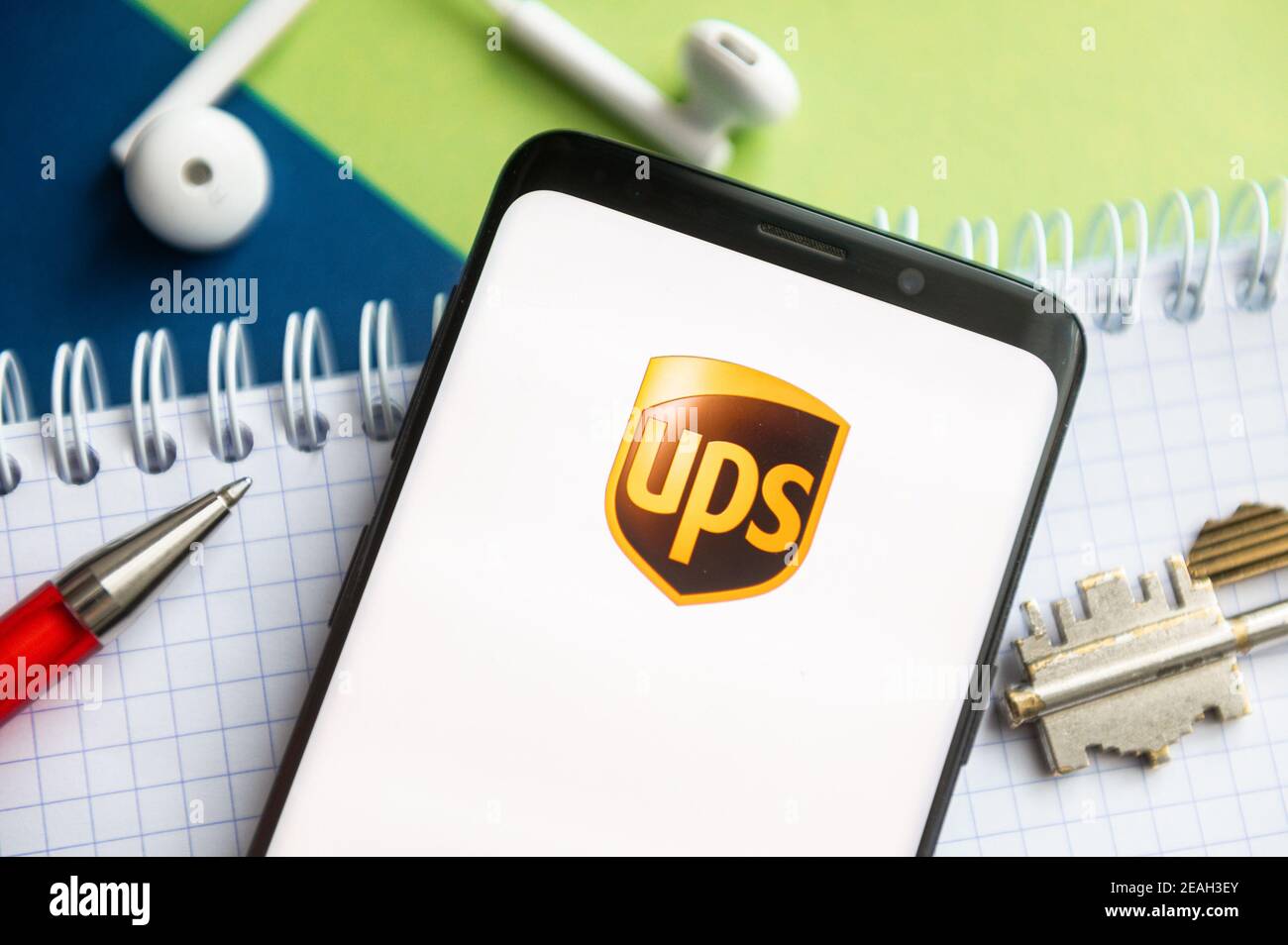 In this photo illustration, a UPS logo seen displayed on a smartphone ...