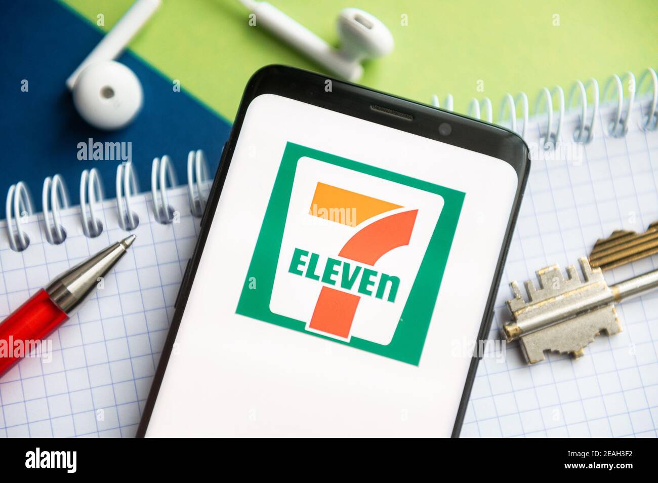 In this photo illustration, a 7 Eleven logo seen displayed on a ...