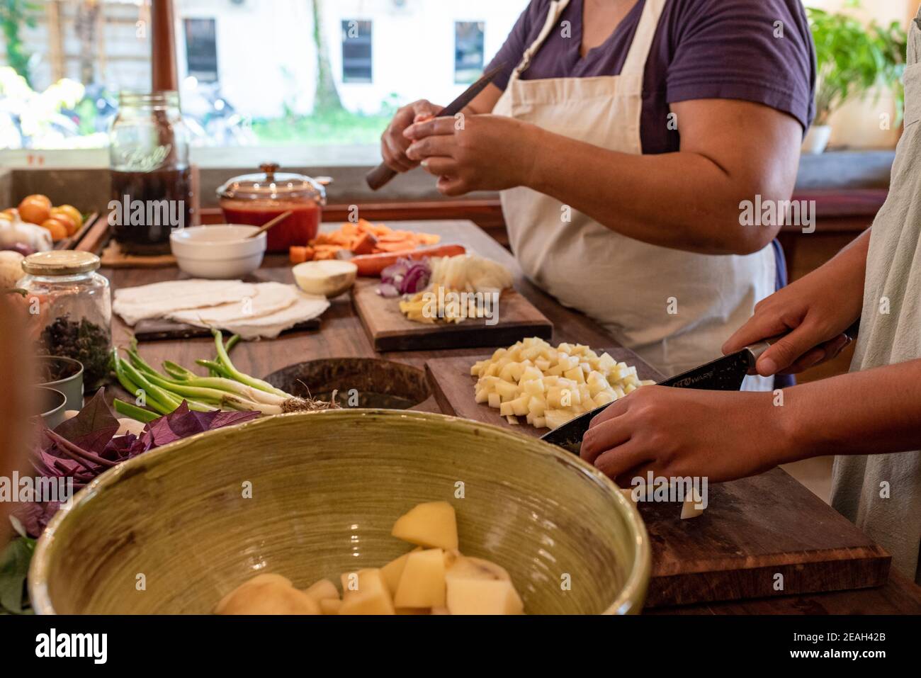 Face Mask Two Asian Female Cooks on Duty Chopping Vegetables Bright ...