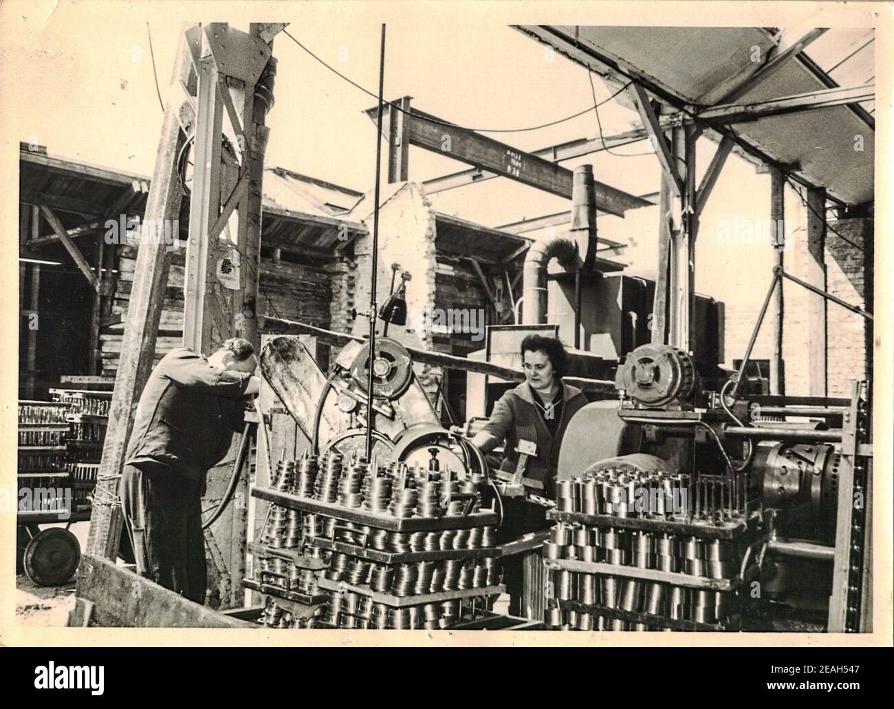 FRAUREUTH, EAST GERMANY - MAY 21, 1965: The retro photo shows workers ...