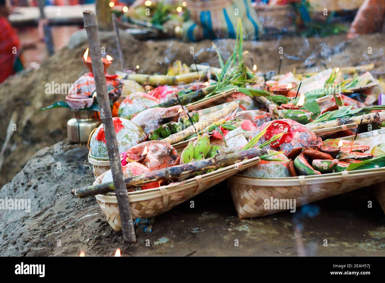 holy offerings of fruits flowers lamps and cloths in river to sun god ...