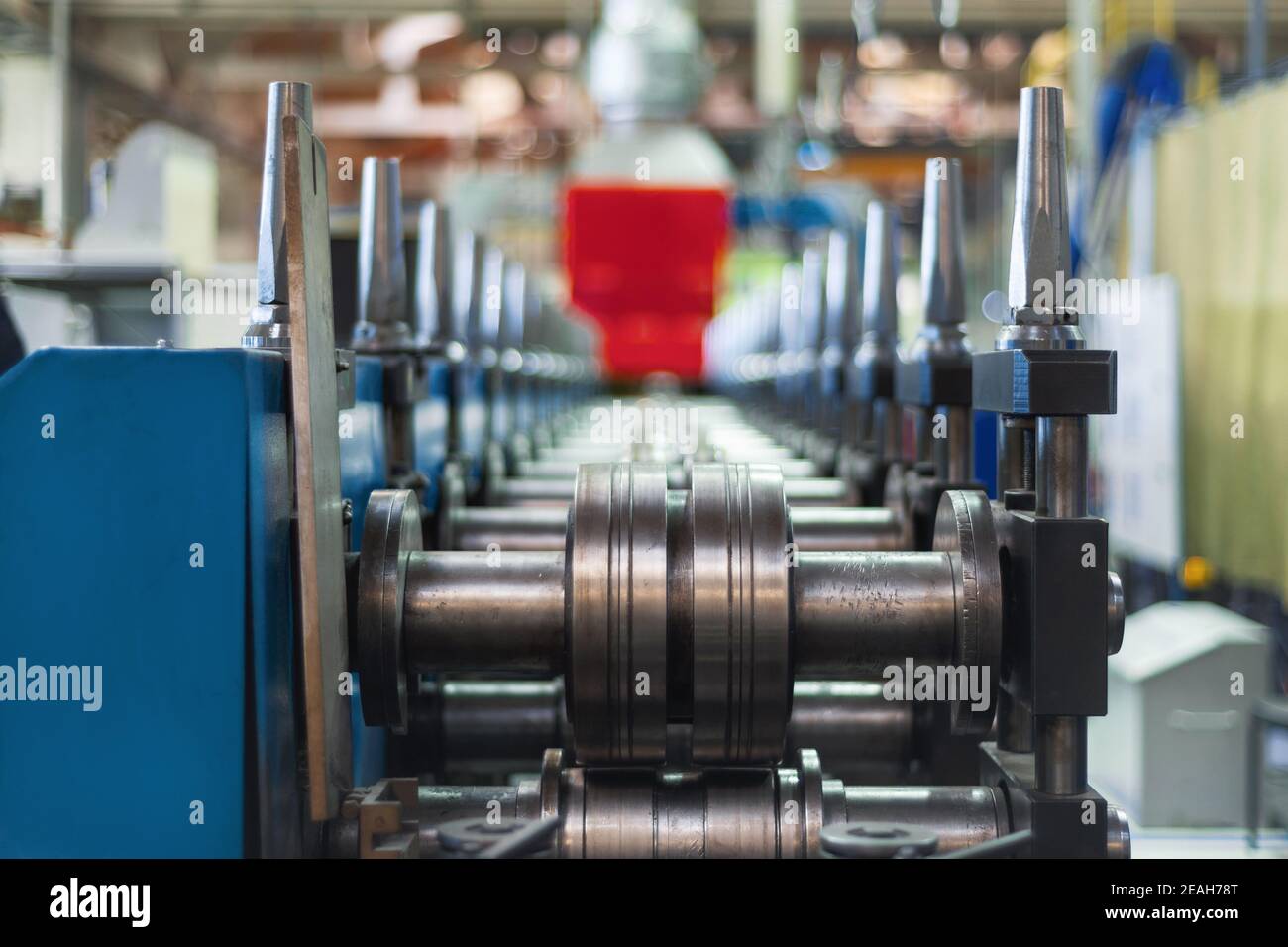 Roller forming machine. The interior of the plant producing a metal ...
