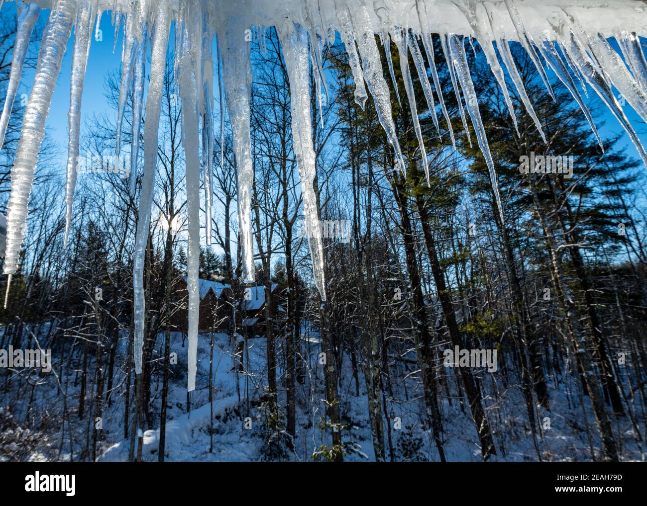 Connecticut, USA, 8 February 2021 - Icecles hanging from the roof of a ...